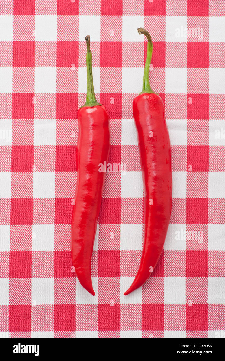 Two red chili peppers Stock Photo - Alamy