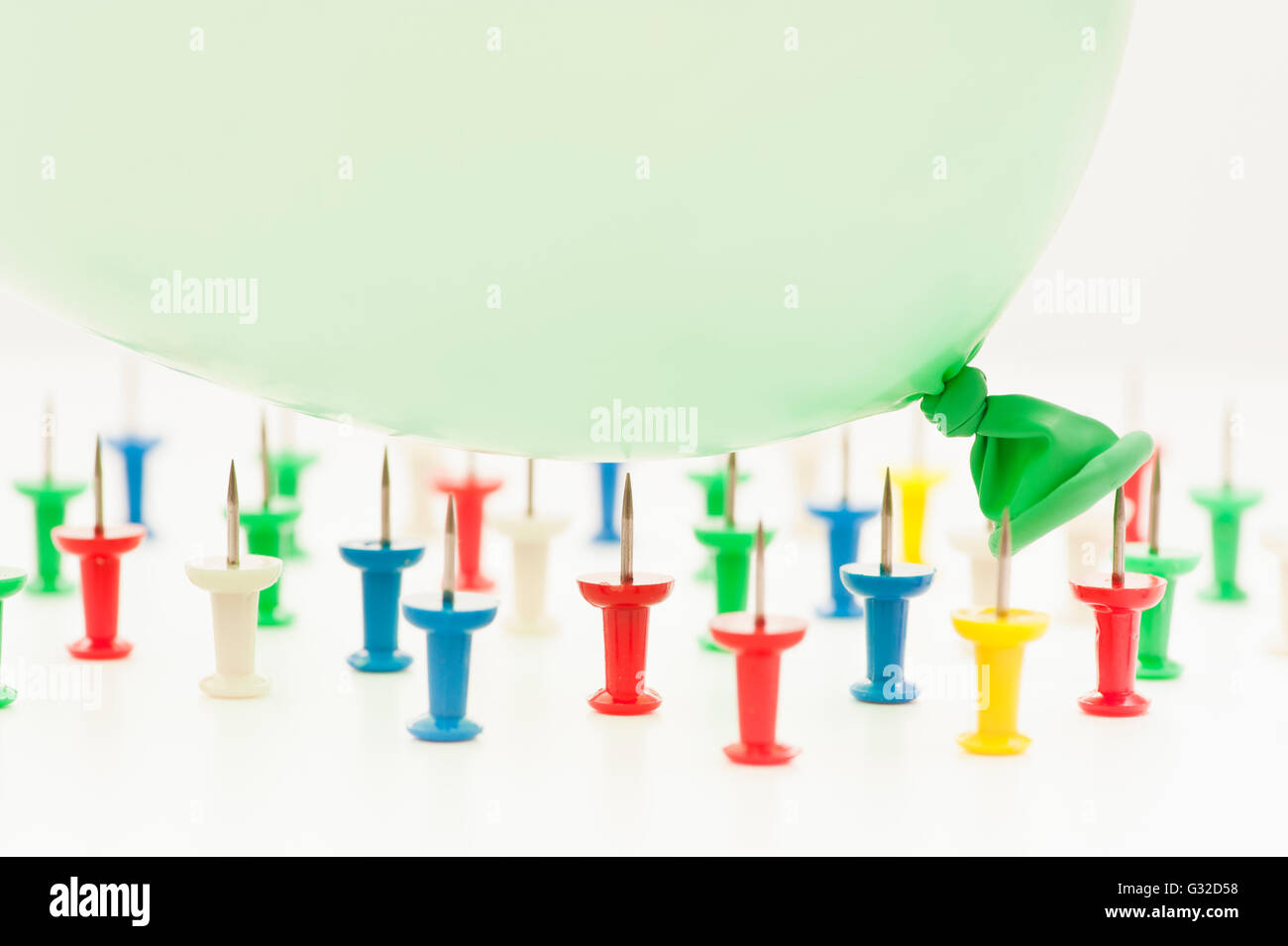 Balloon falling on pins Stock Photo - Alamy