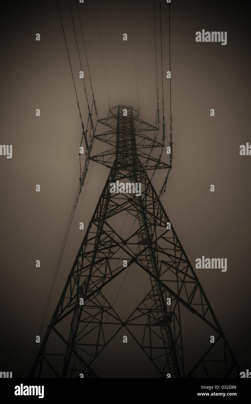 Power pylon in fog Stock Photo - Alamy