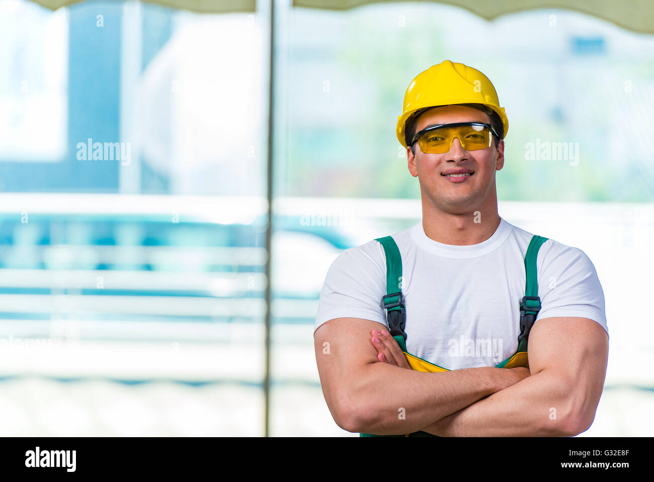Young construction worker working at the site Stock Photo - Alamy