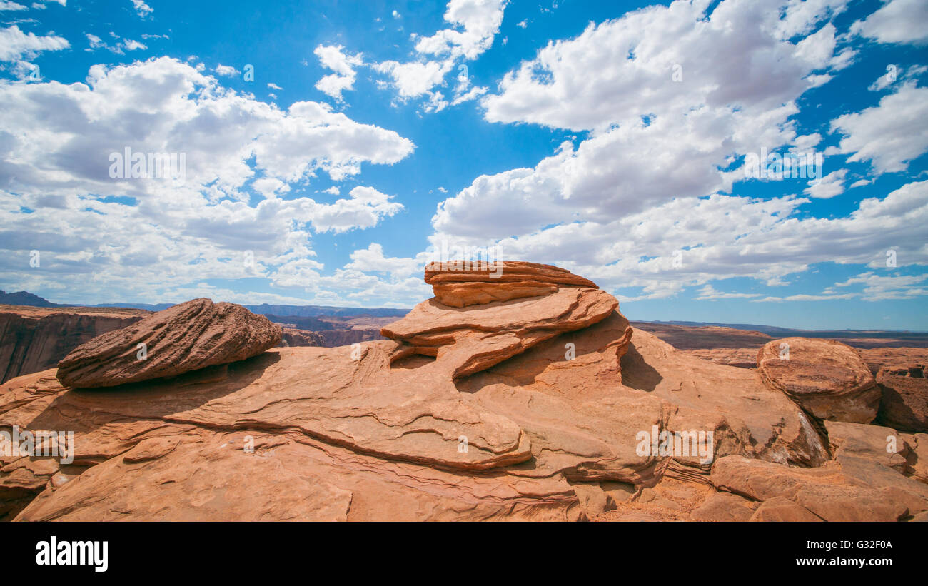 Strange twisted rock layers make orange sandstone geologic formations ...