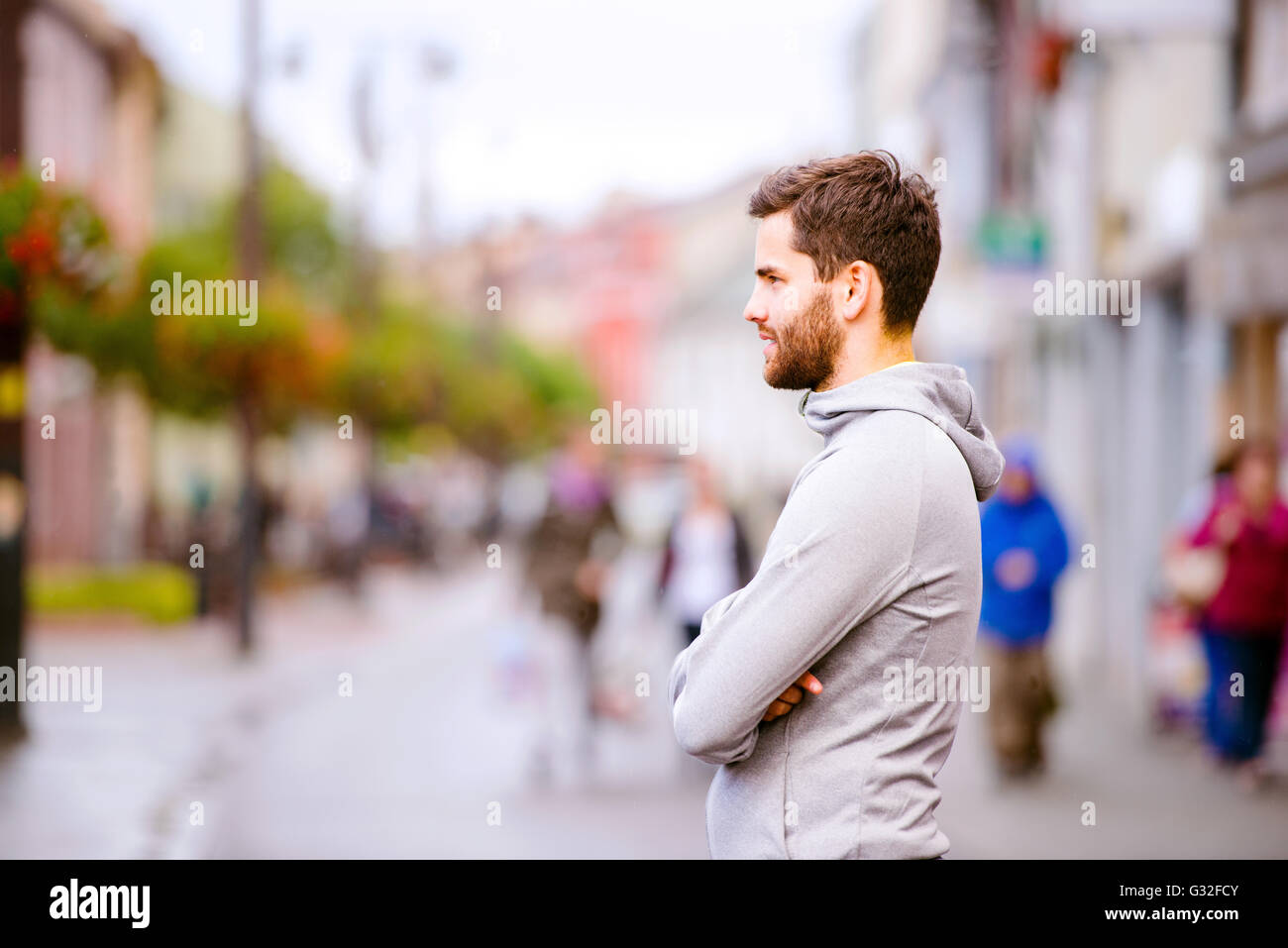Young hipster man running in town, resting Stock Photo - Alamy