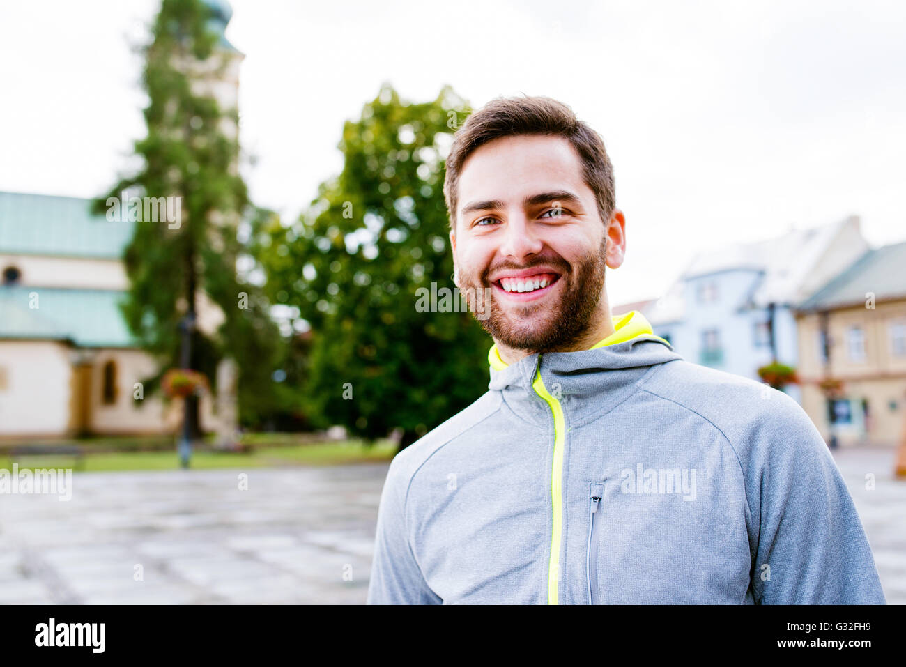 Young hipster man running in town, resting Stock Photo - Alamy