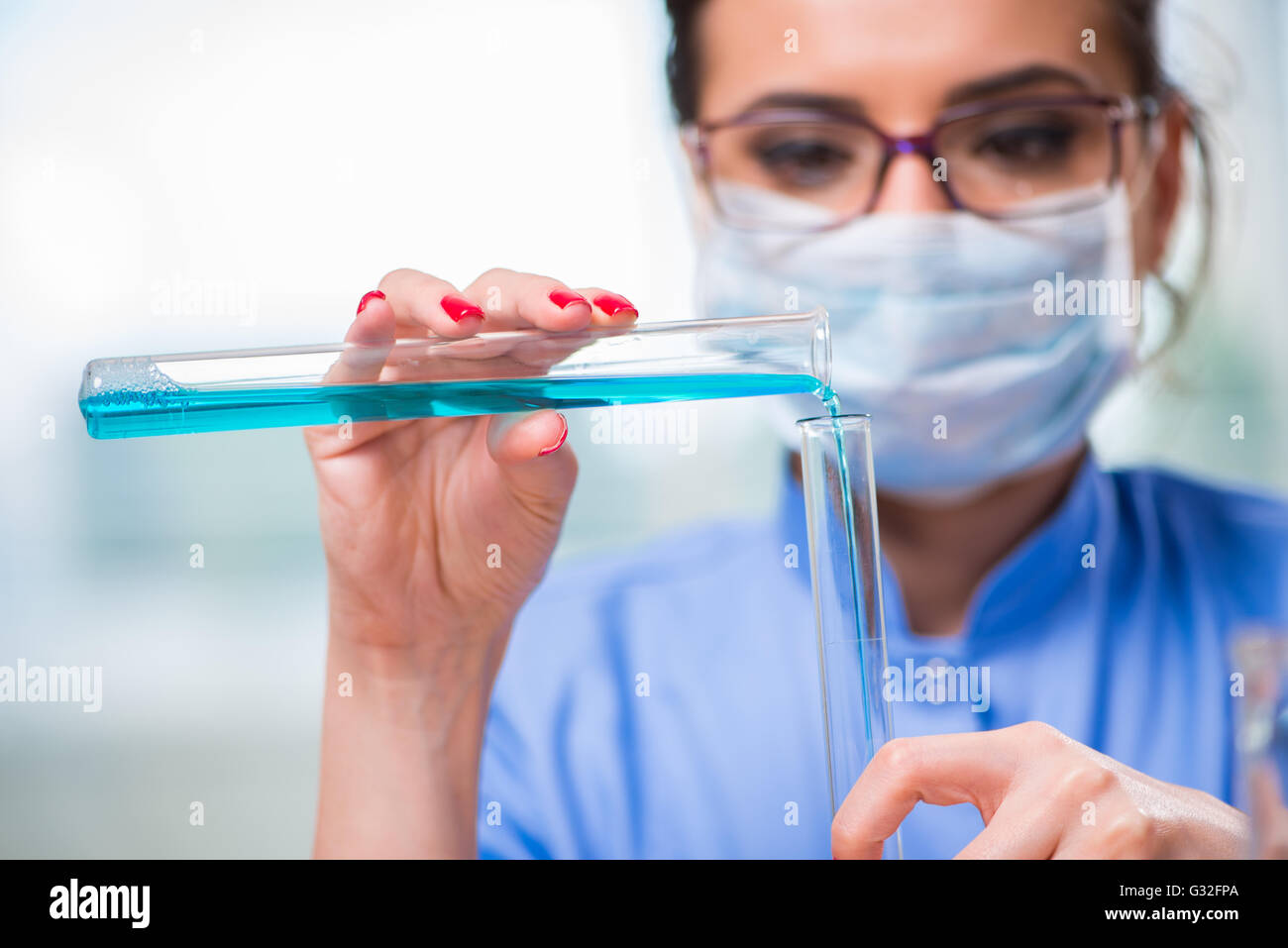 Woman doctor doing chemical tests in laboratory Stock Photo - Alamy