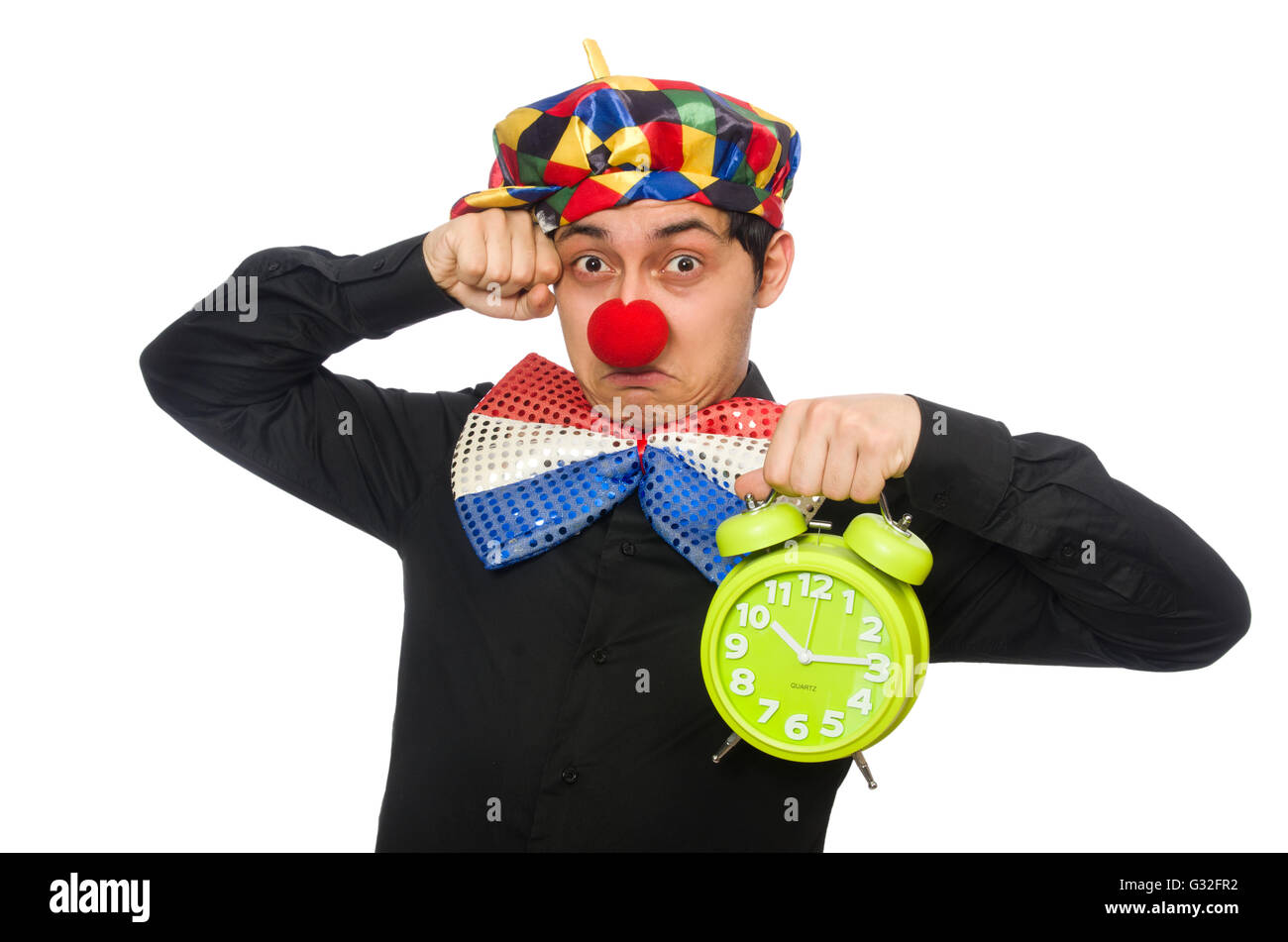 Funny clown with clock isolated on white Stock Photo - Alamy