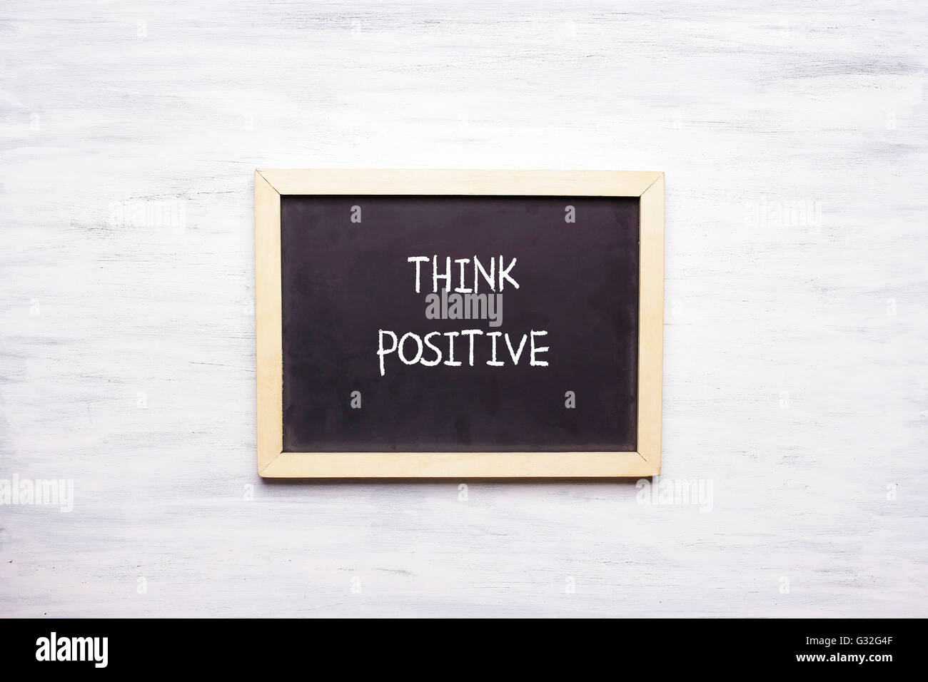 Top view of chalkboard with quote THINK POSITIVE written on it ...