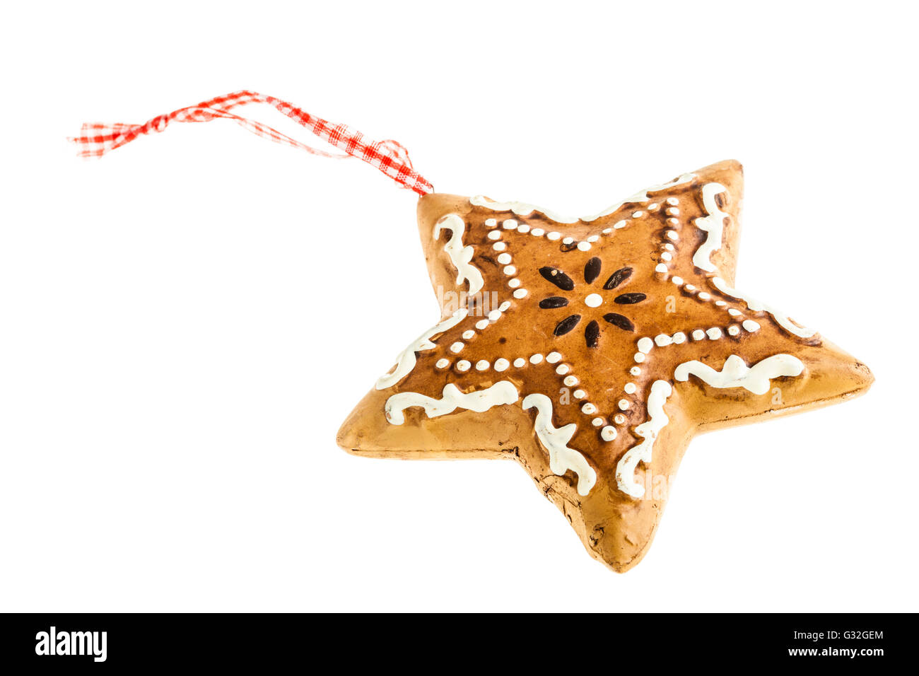 a star shaped gingerbread christmas ornament isolated over a white ...