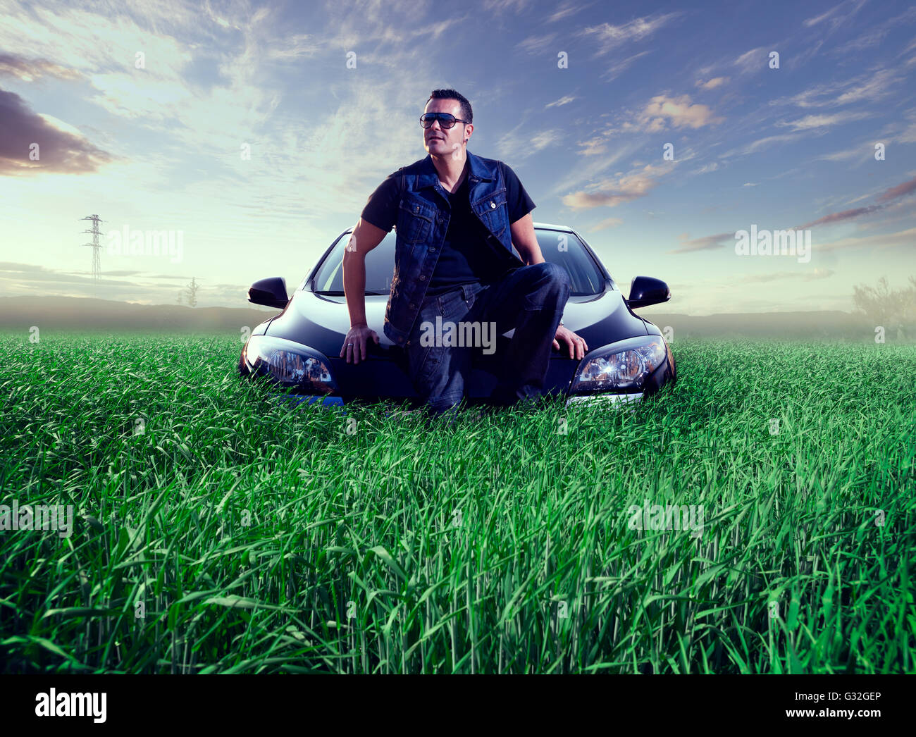 Man and car concept.Green grass landscape Stock Photo - Alamy