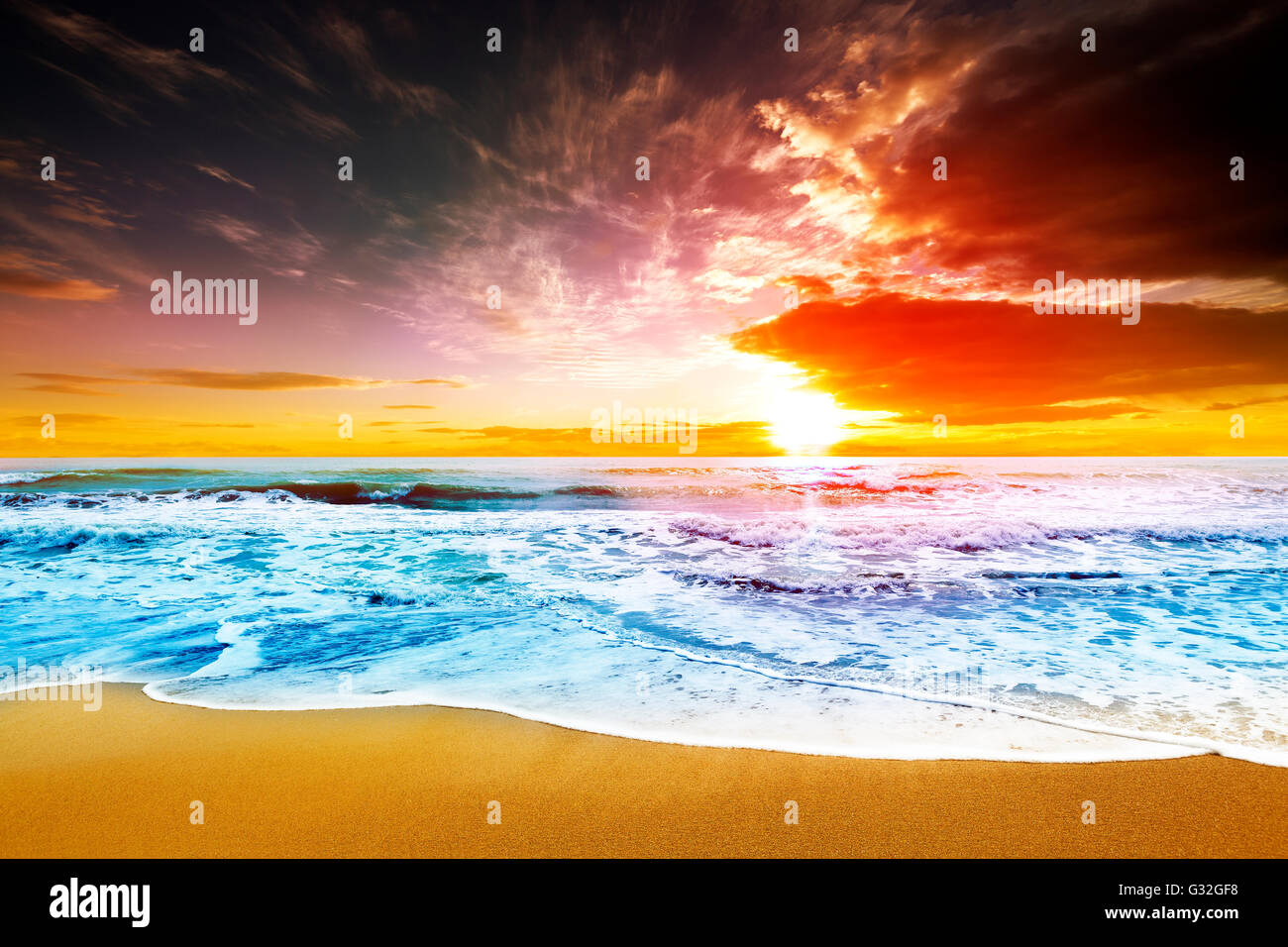Dreamy sunset at beach shore Stock Photo - Alamy