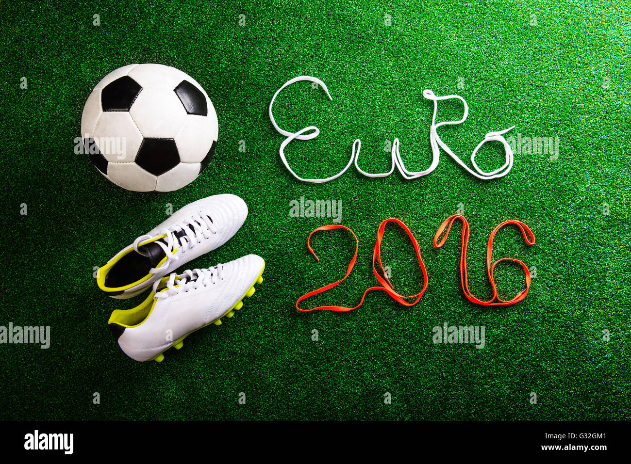 Soccer ball, cleats and Euro 2016 sign against artificial turf Stock ...