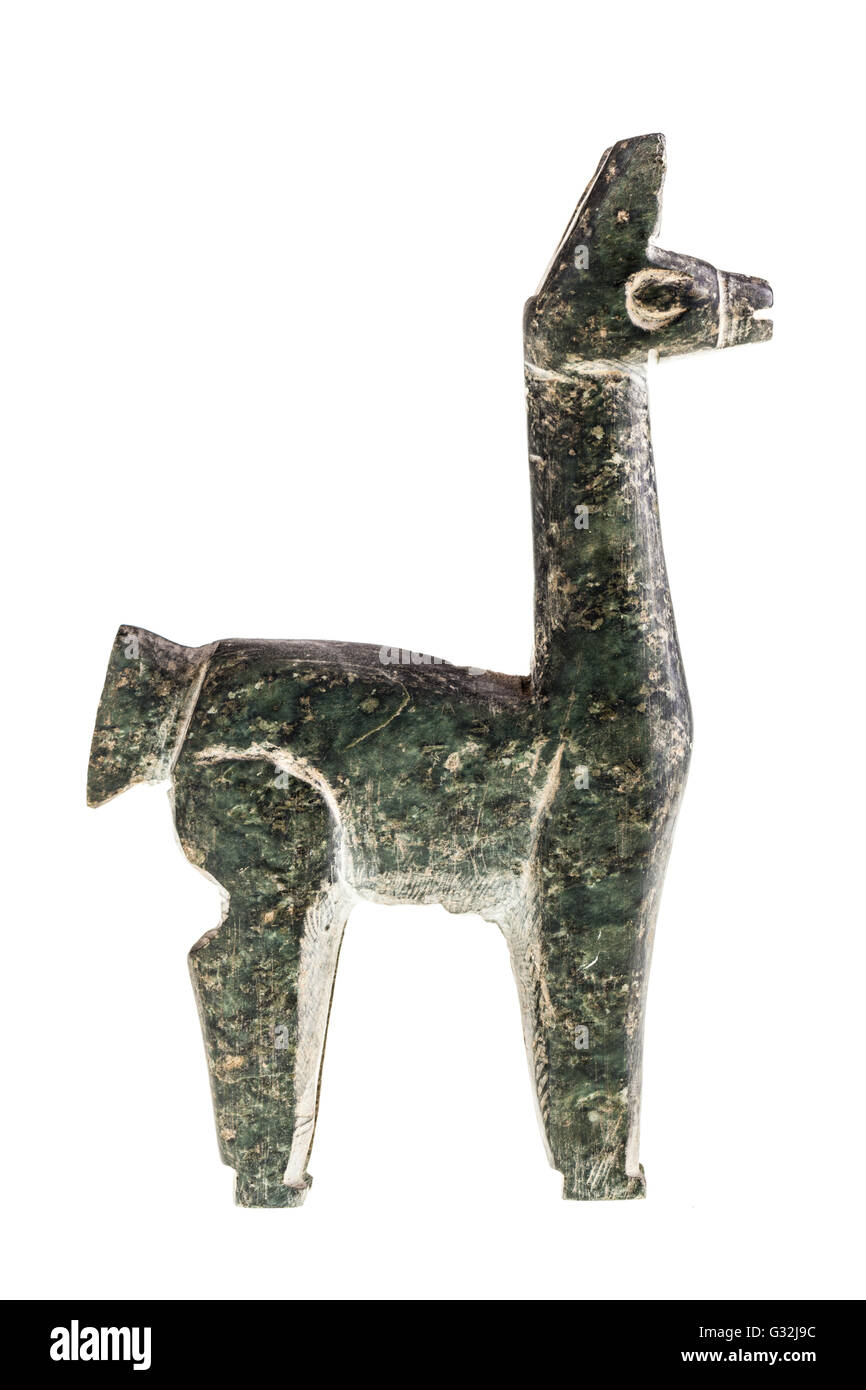 a peruvian stone llama figurine isolated over a white background Stock ...