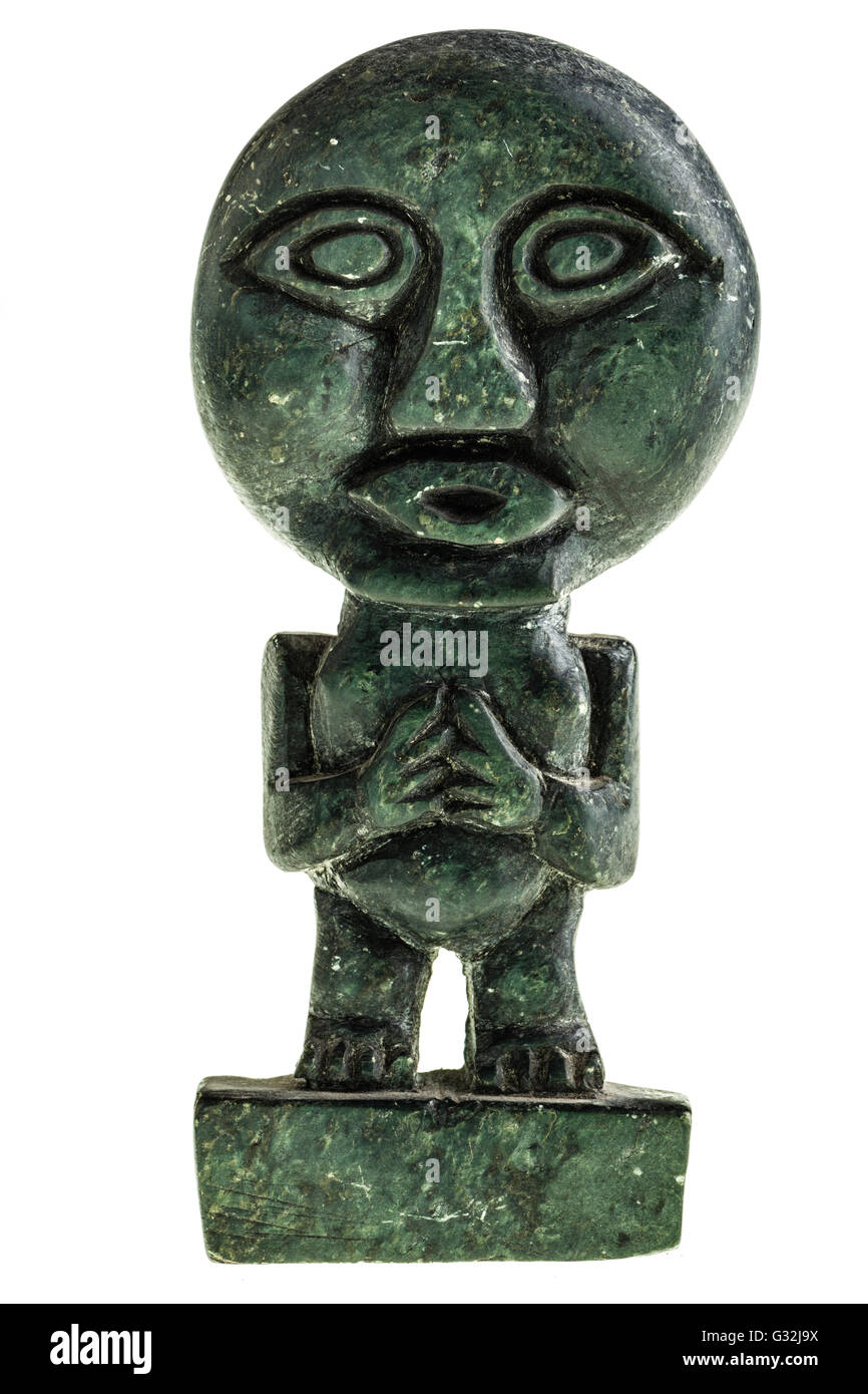 an ancient pagan statuette isolated over a white background Stock Photo ...