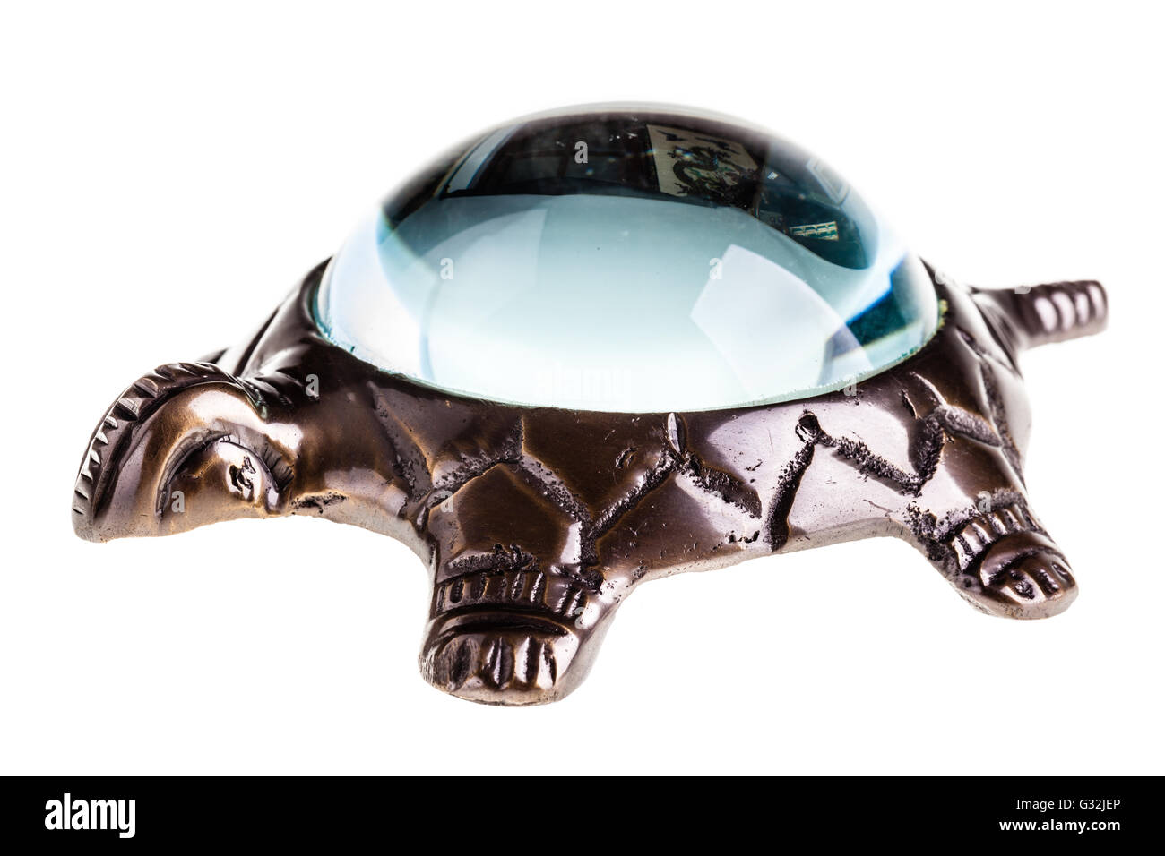 a turtle shaped desk magnifiyng glass isolated over a white background ...