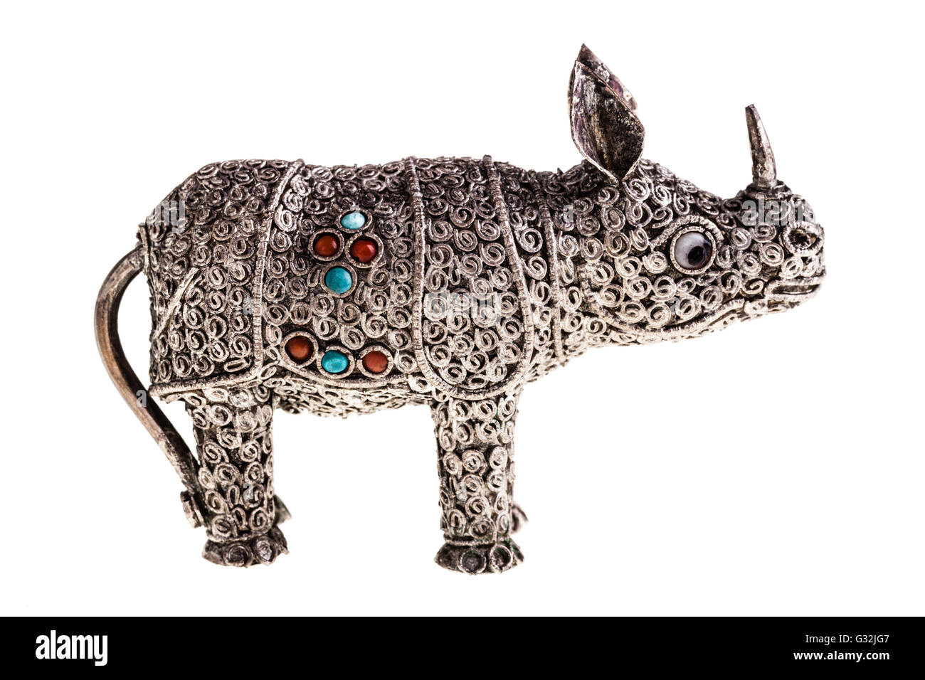 a silver rhino figurine isolated over a white background Stock Photo ...