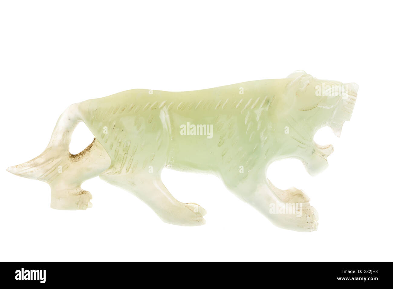 a chinese jade tiger isolated over a white background Stock Photo - Alamy