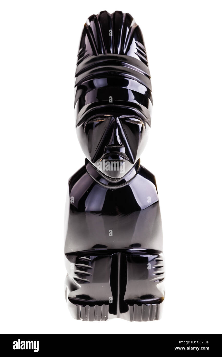 an aztec obsidian ancient statuette isolated over a white background ...