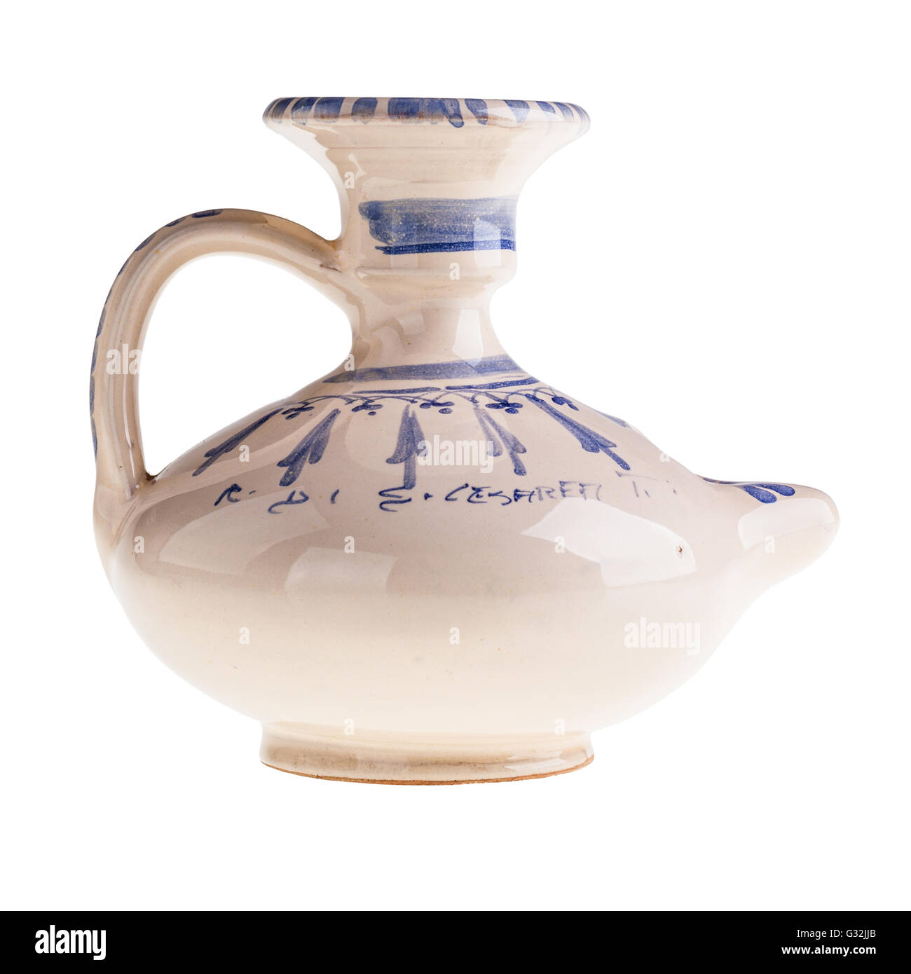 a ceramic italian oil lamp isolated over a white background Stock Photo ...