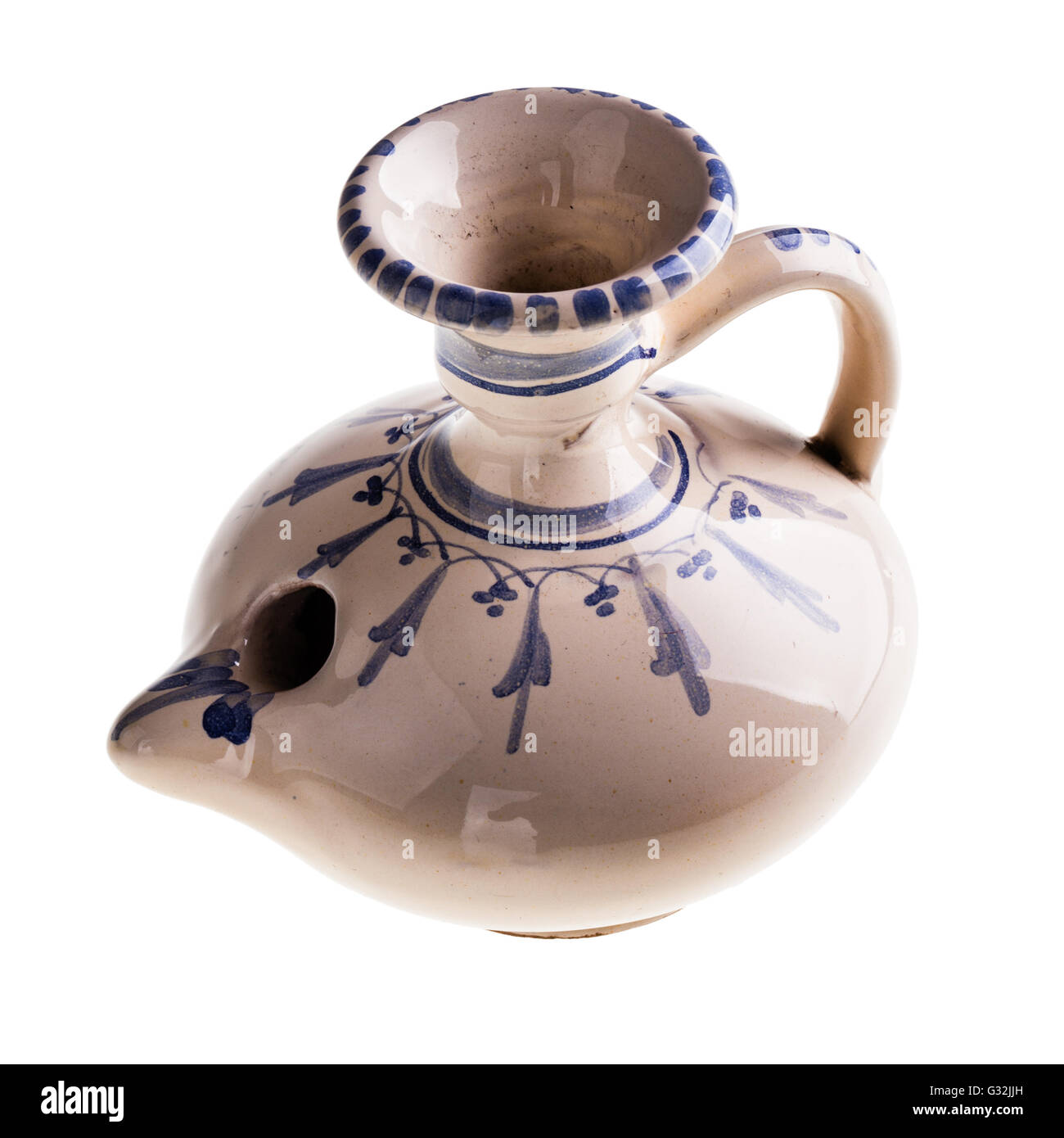 a ceramic italian oil lamp isolated over a white background Stock Photo ...