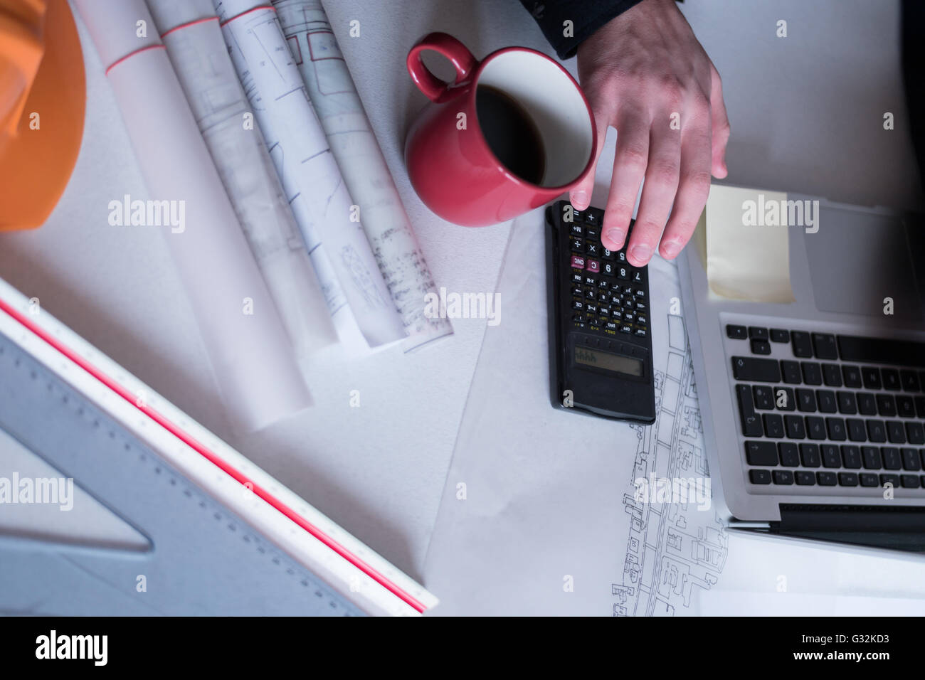 Architect working on blueprint. Architects workplace - architectural ...