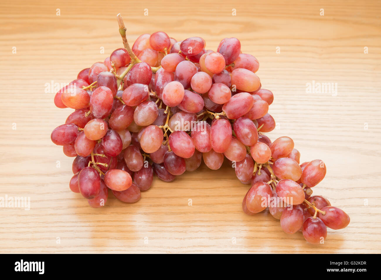 fresh grapes on a wood table Stock Photo - Alamy