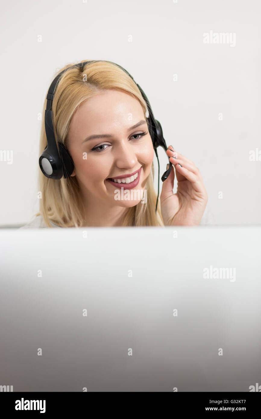 Woman customer service worker, call center smiling operator with phone headset Stock Photo - Alamy