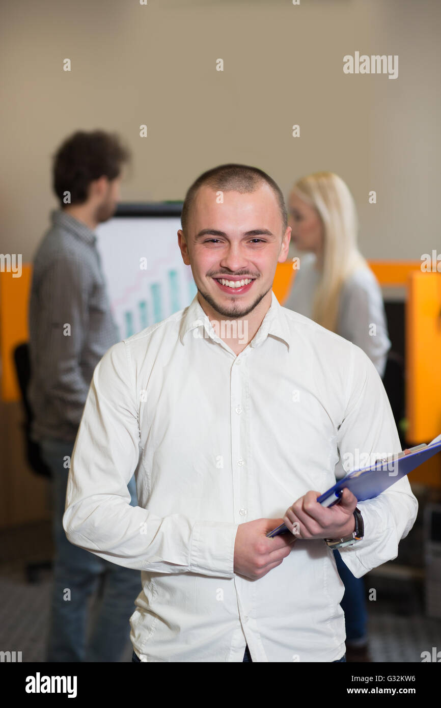 Portrait of young confident men employee dressed in casual clothes ...