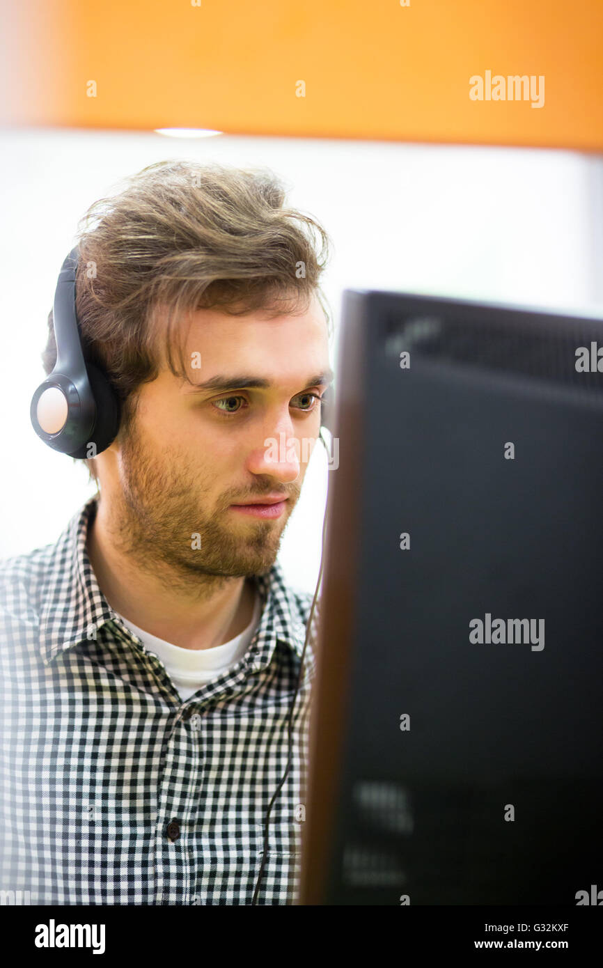 Friendly telephone operator smiling during a telephone conversation ...