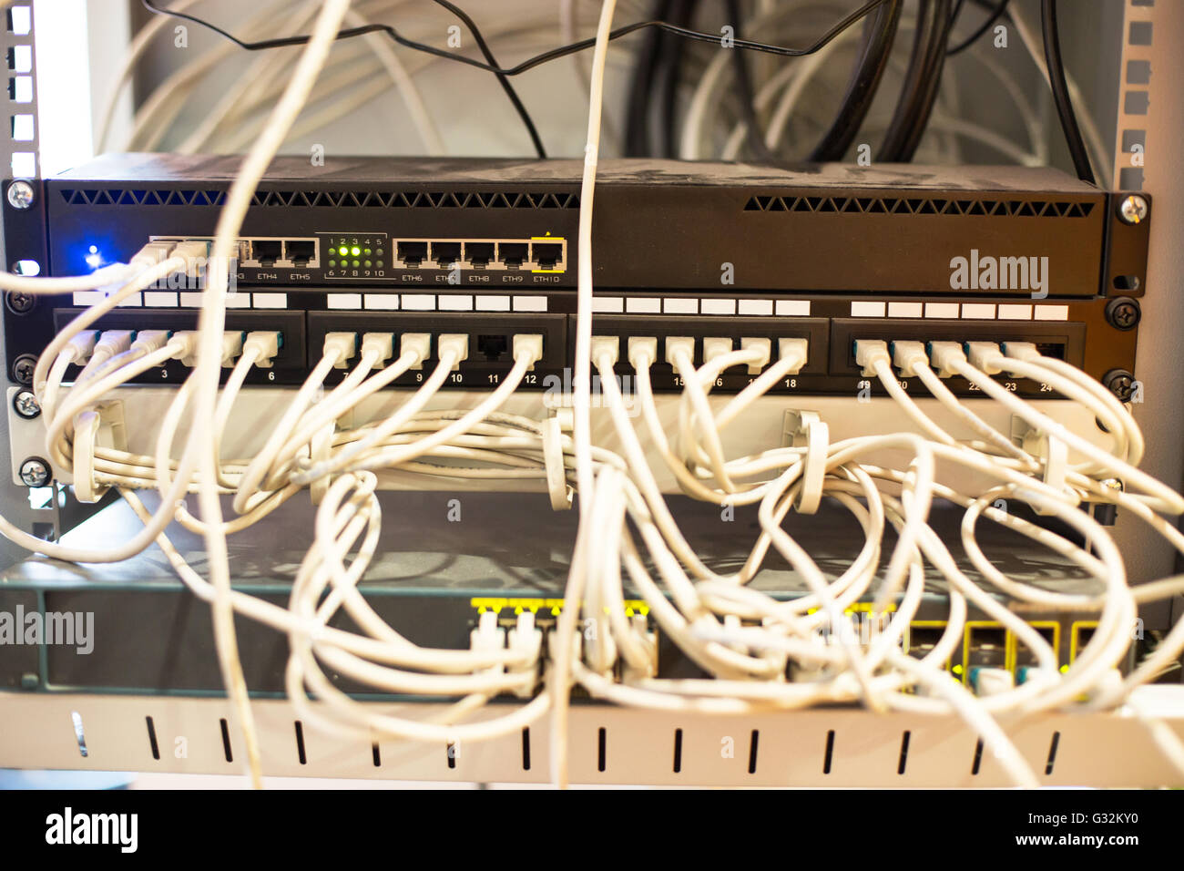 network cables connected to switch - closeup of data center hardware ...