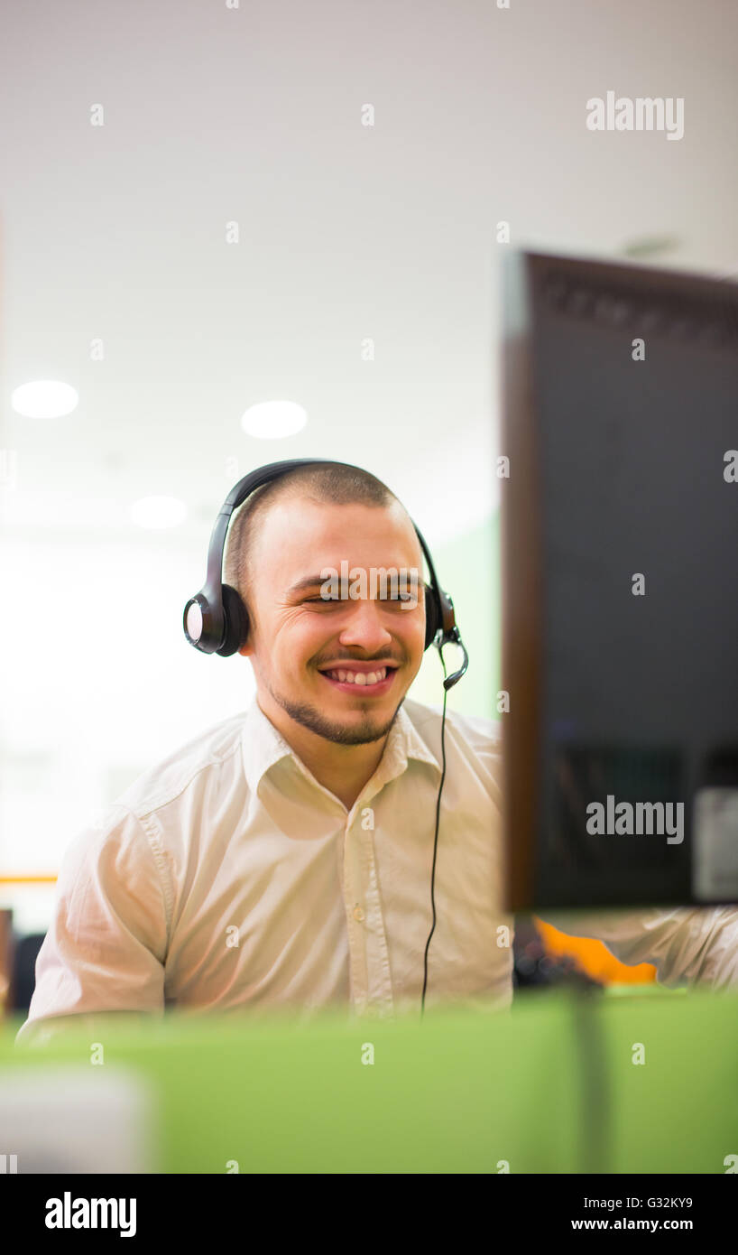 Friendly Service Agent Talking To Customer In Call Centre Stock Photo ...