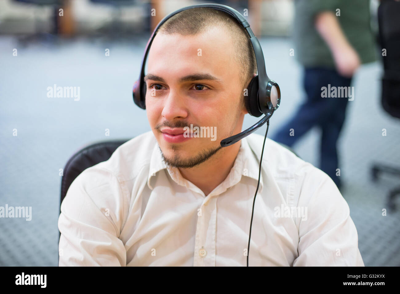 Friendly Service Agent Talking To Customer In Call Centre Stock Photo ...