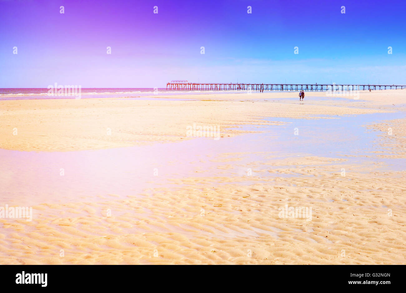Summer is here couple walking along beautiful expansive beach, with ...
