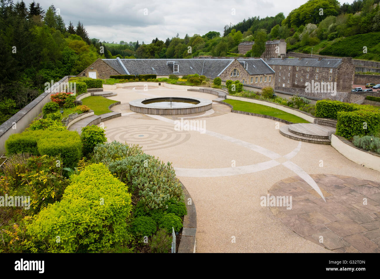 View of historic New Lanark UNESCO World Heritage site from roof garden ...