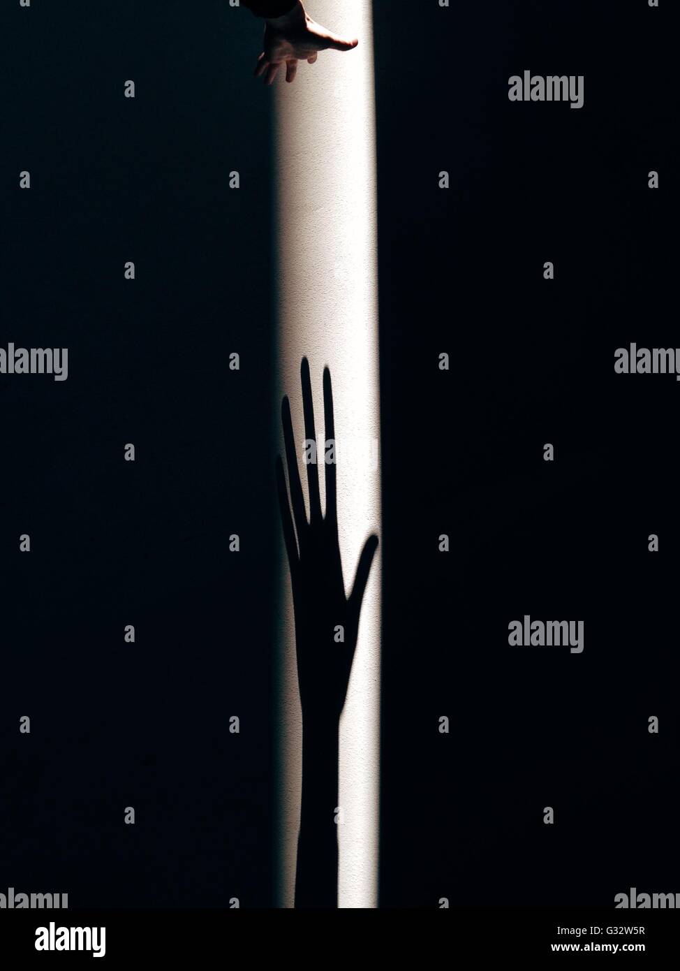 Human hand and shadow Stock Photo - Alamy