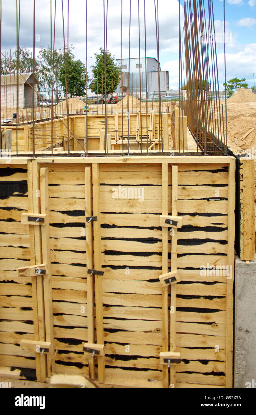 the formwork of wooden boards for pouring concrete foundations in ...