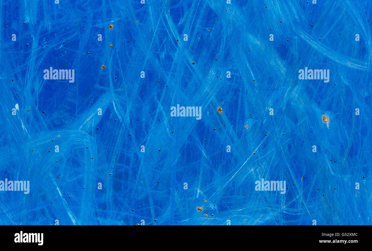 a detail image of random scratches on a blue metal panel Stock Photo ...