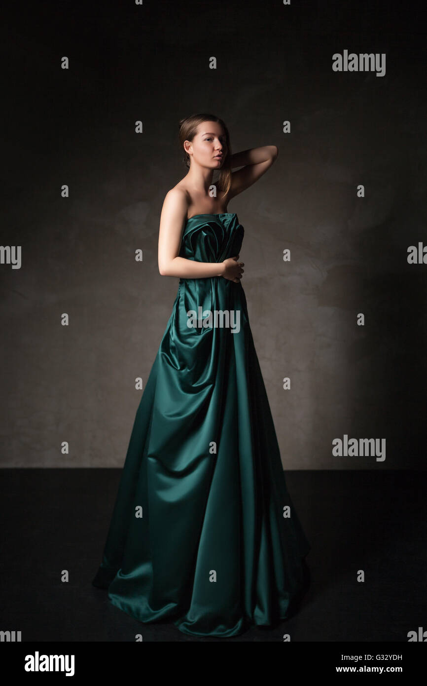 Model posing in green fashion dress Stock Photo - Alamy