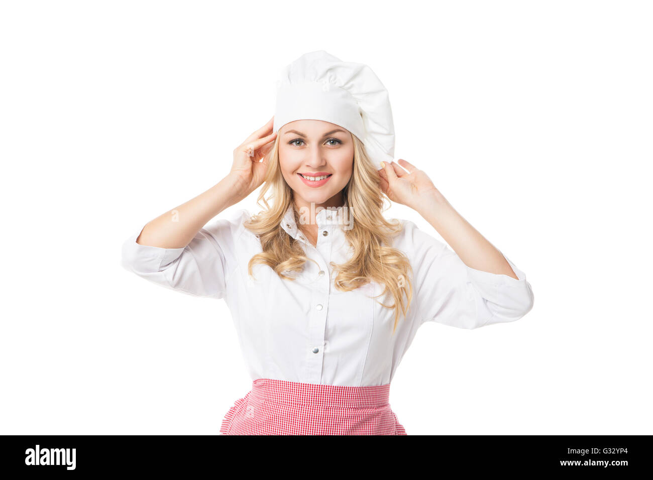 Portrait of smiling woman in chef uniform with blonde long hair looking ...