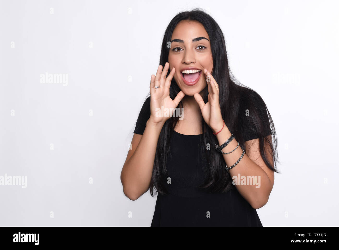 Beautiful young woman shouting and screaming. Isolated white background ...