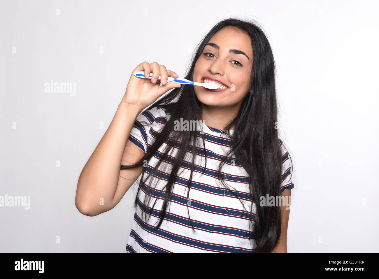 Close-up woman brushing her teeth. Isolated white background Stock ...