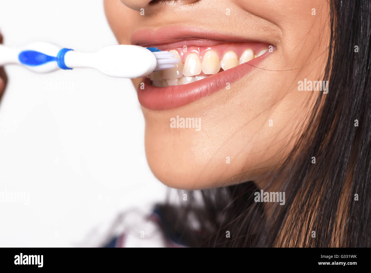 Close-up woman brushing her teeth. Isolated white background Stock ...