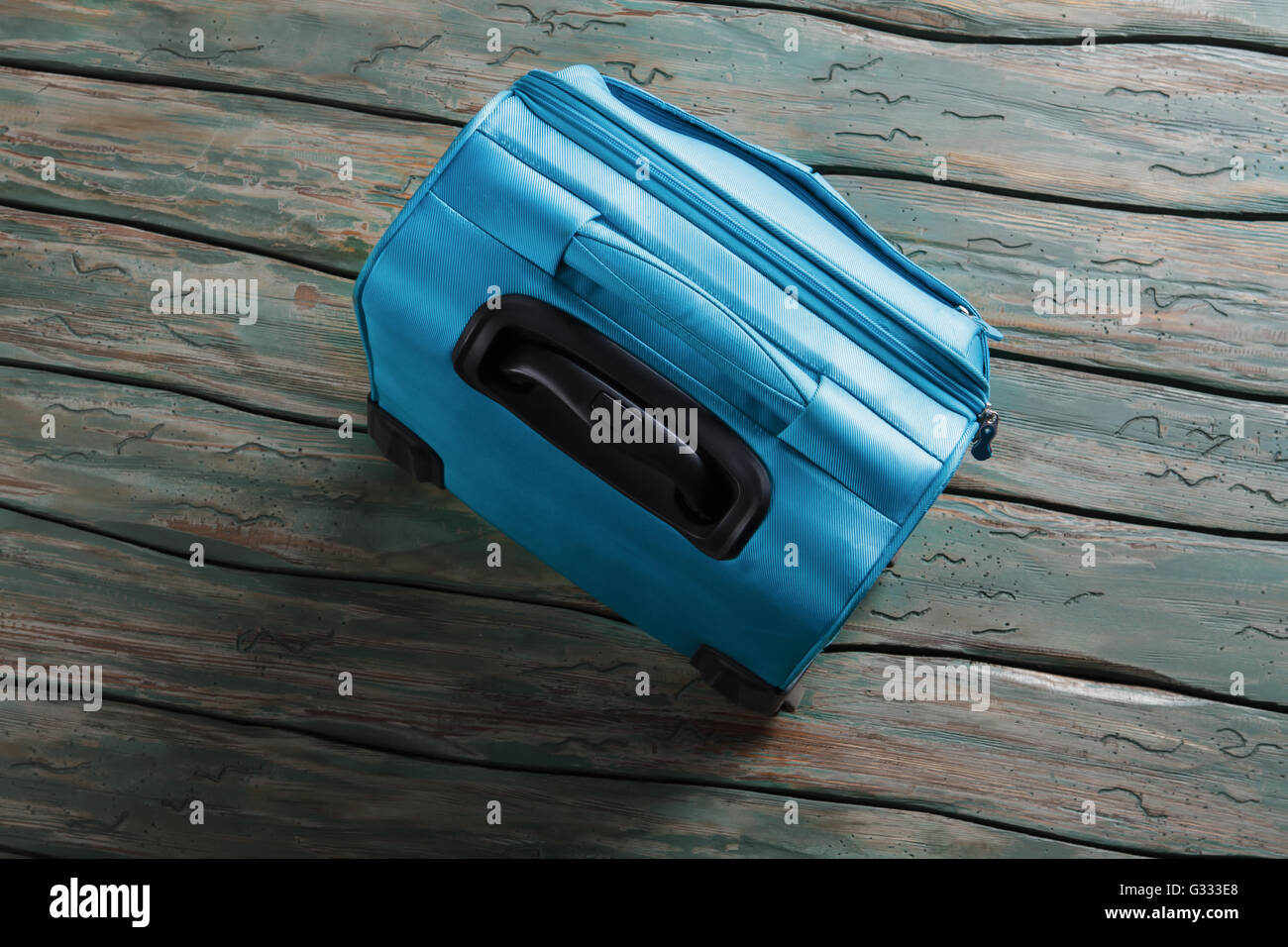 Blue luggage bag with handle Stock Photo - Alamy