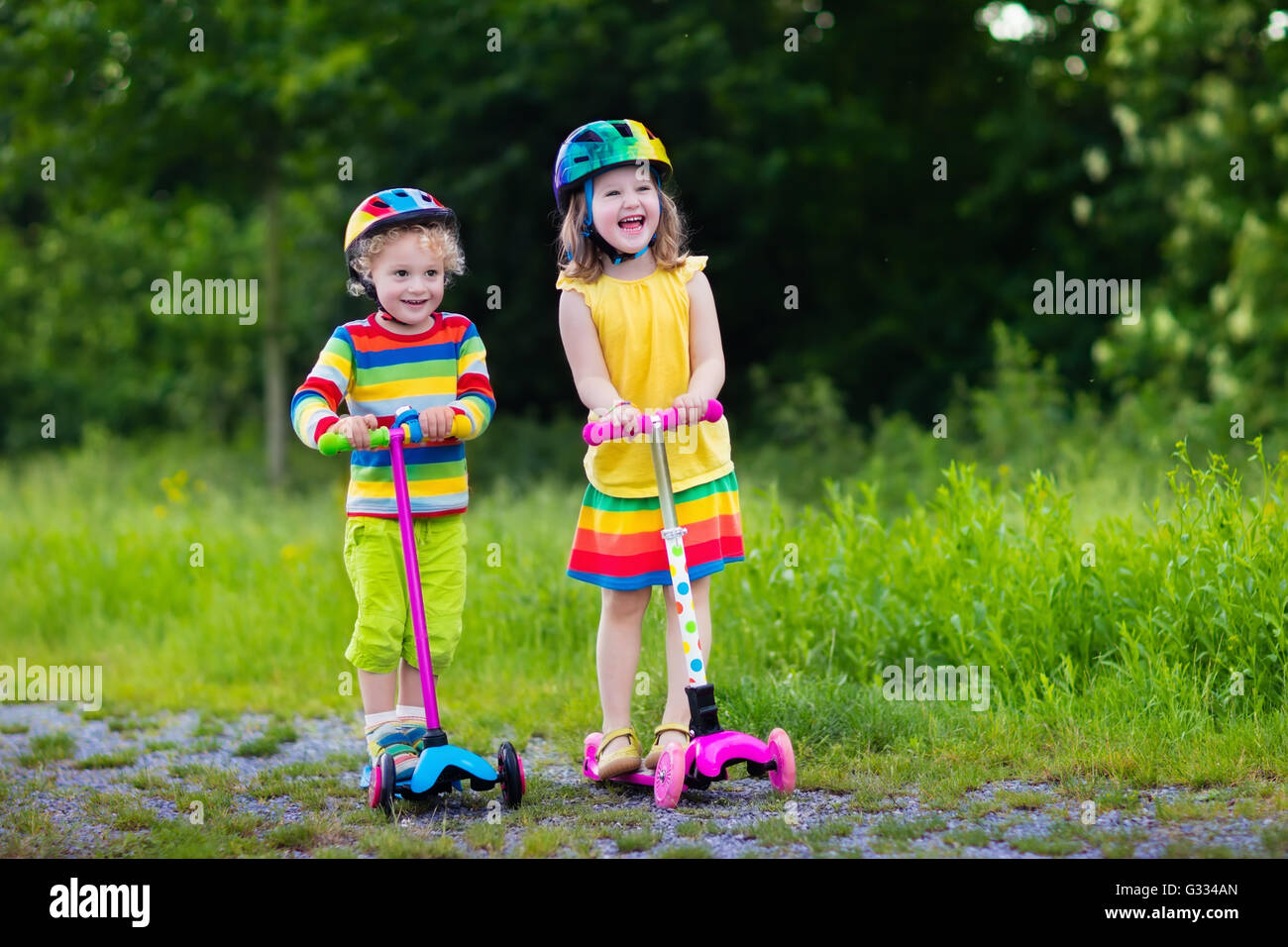 Child riding step scooter scooters hi-res stock photography and images ...
