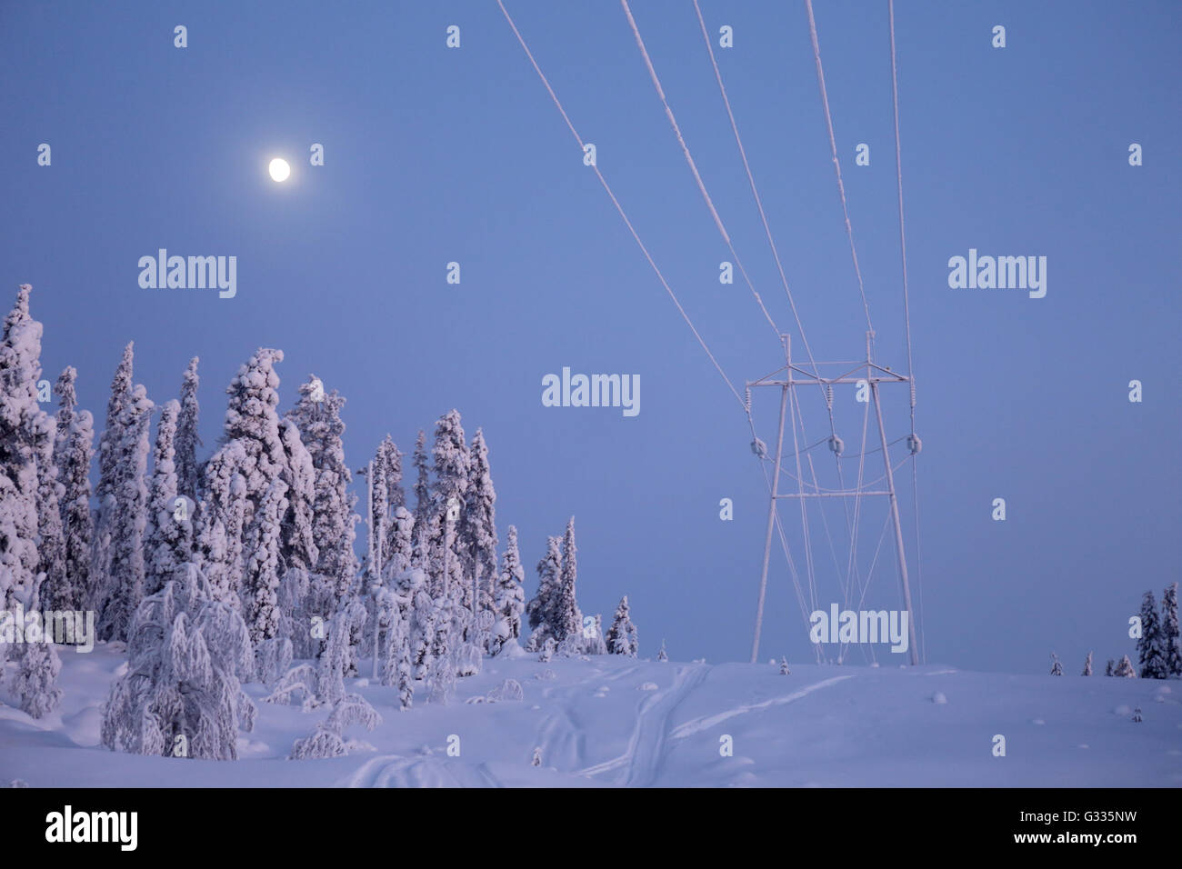 ?k skero, Finland, frozen power lines and utility pole in the moonlight Stock Photo - Alamy