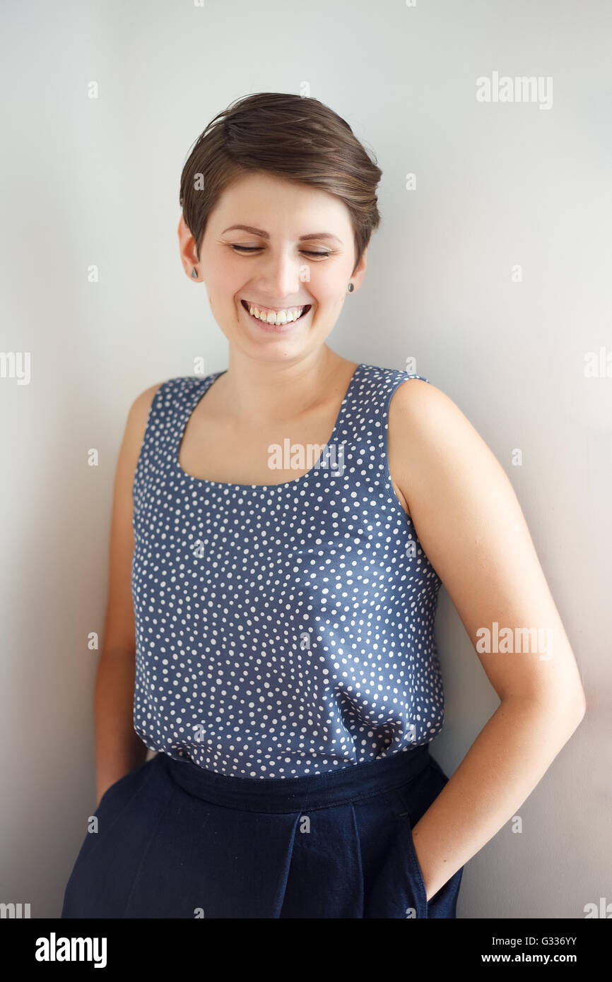 Charming short hair young woman without makeup on white background ...