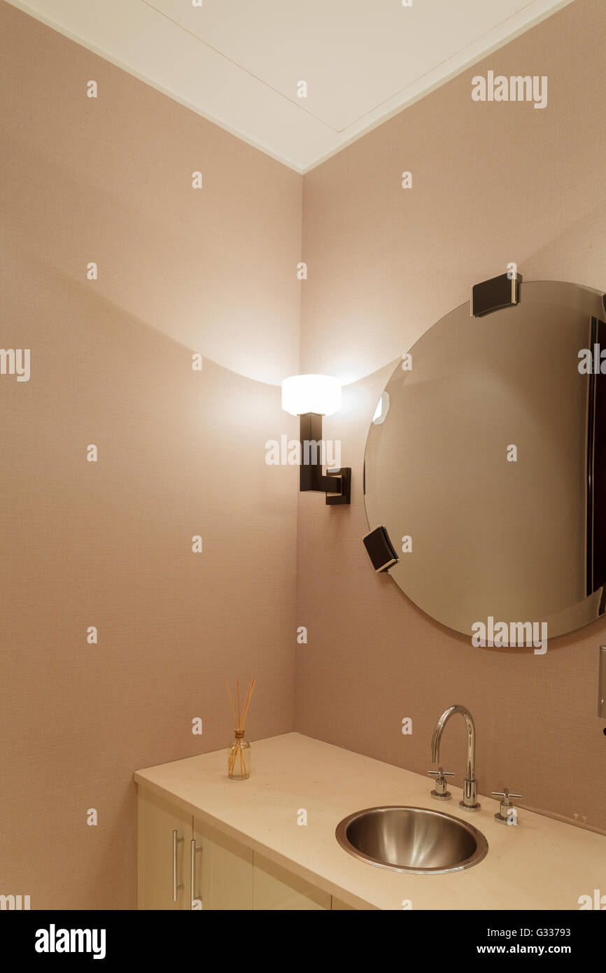 Modern office washroom interior with mirror and lamps Stock Photo - Alamy