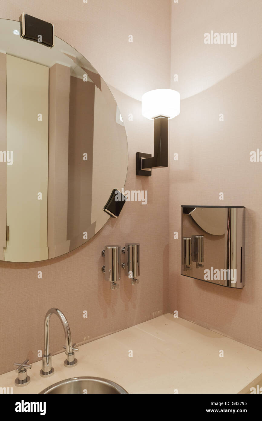 Modern office washroom interior with mirror and lamps Stock Photo - Alamy