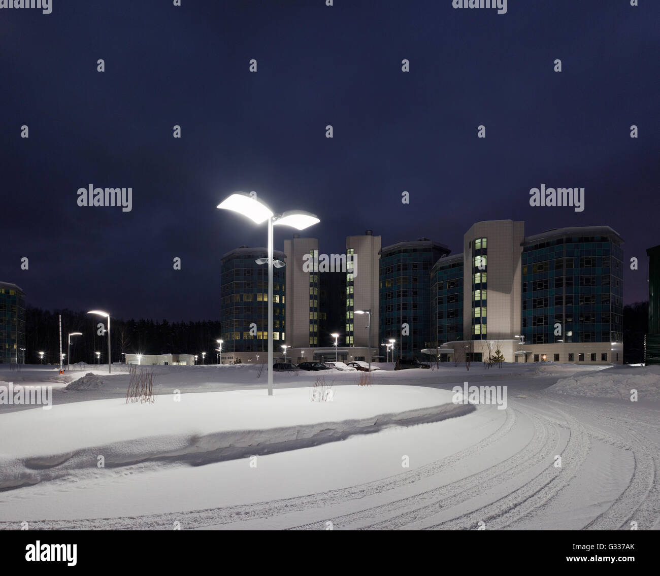Street lamps of the office complex. Lighting supports and lamps. Winter ...