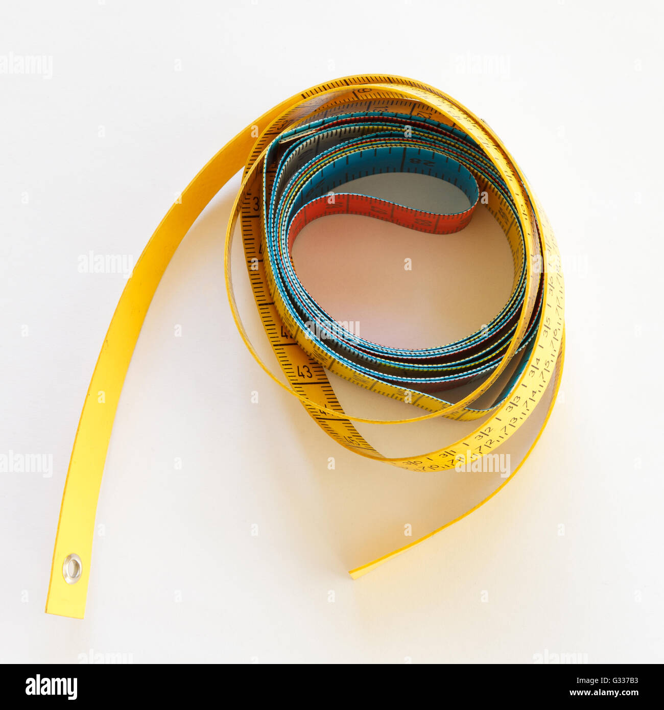 Rolled sartorial meter on a white background. Close up, top view Stock ...