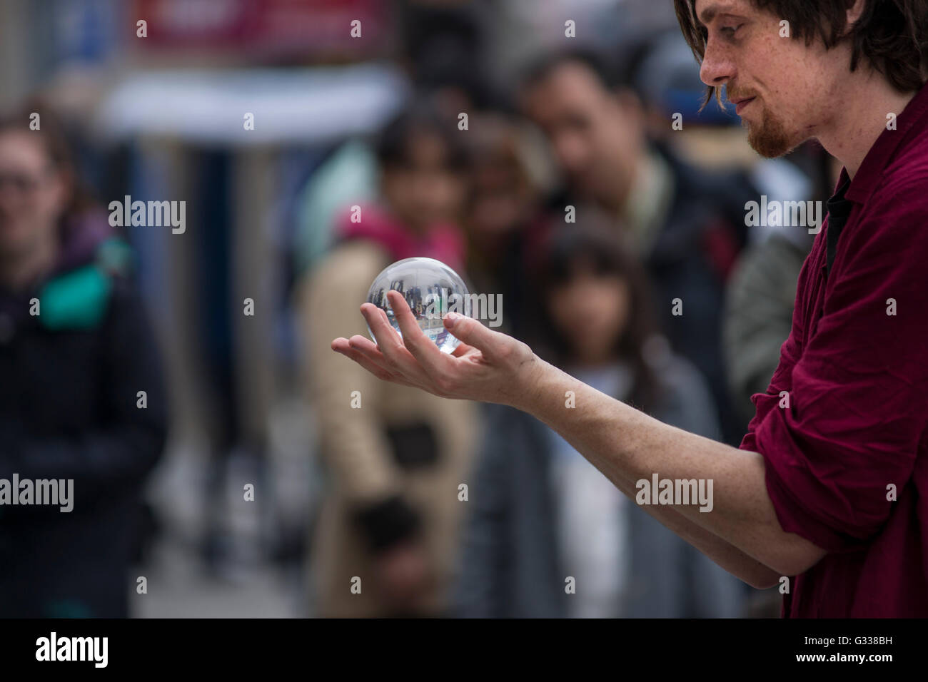 Street performer juggling crystal ball hi-res stock photography and ...