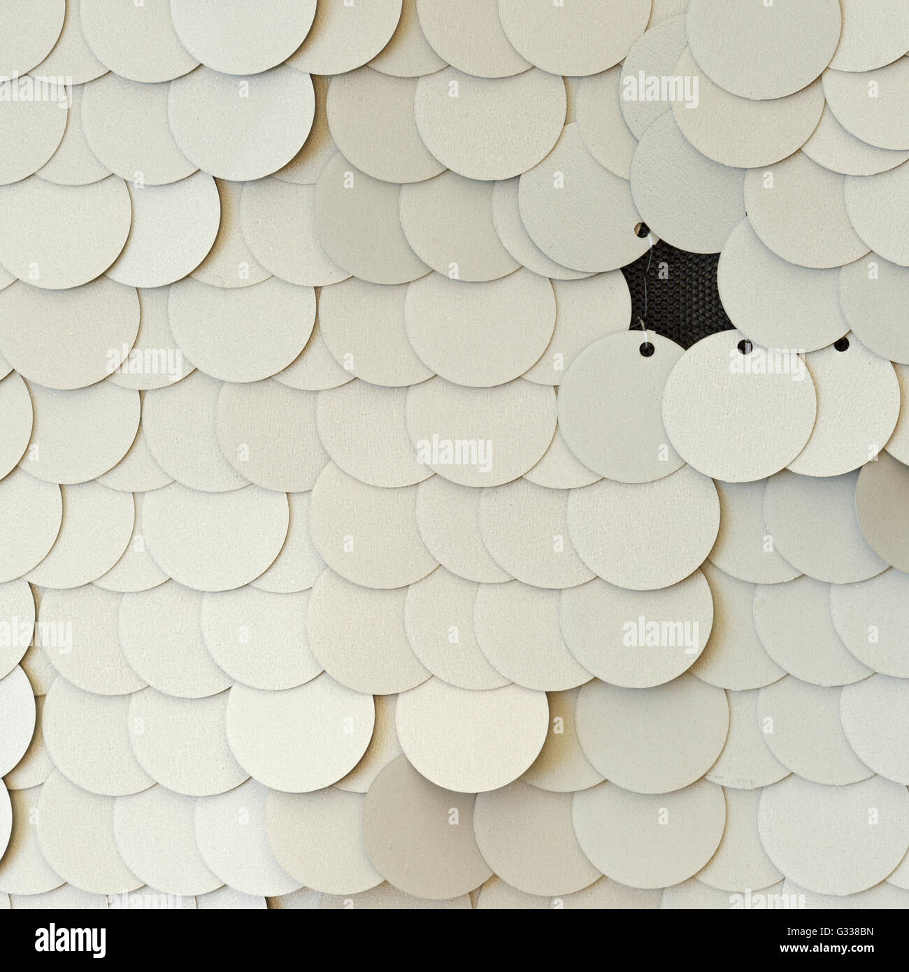 The fabric scales. Polyester base covered with a round white plastic ...